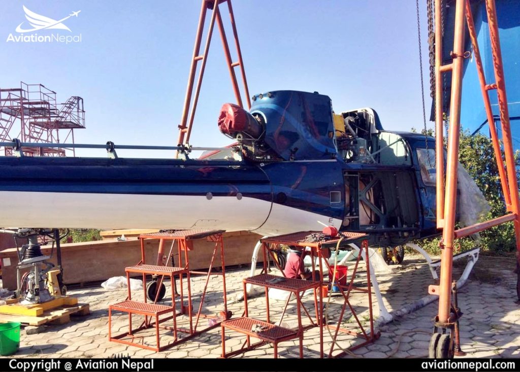 Simrik Air AS350B2 being assembled at East Helipad, TIA