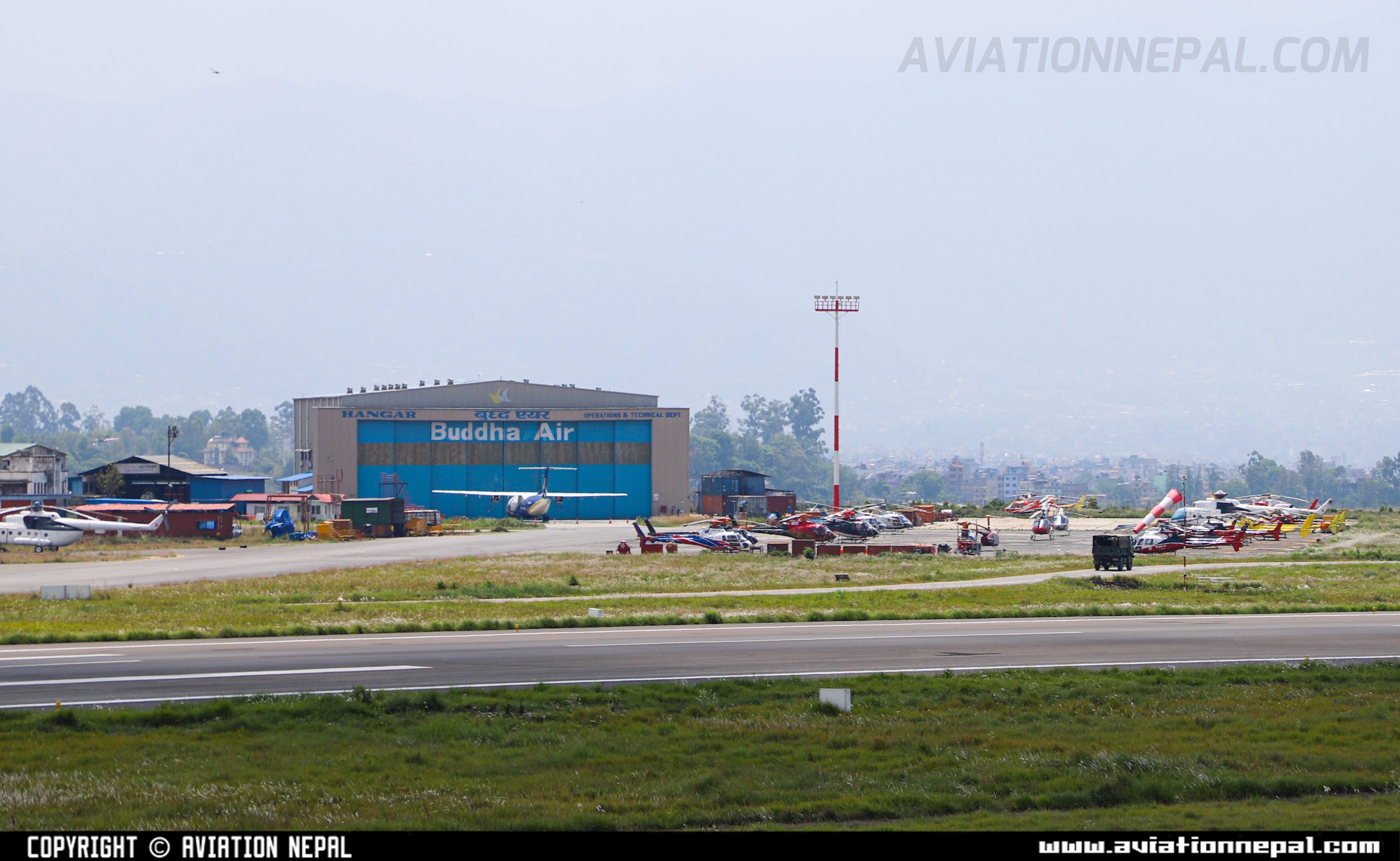 Airplanes and Helicopters on the tarmac of the Tribhuvan International ...